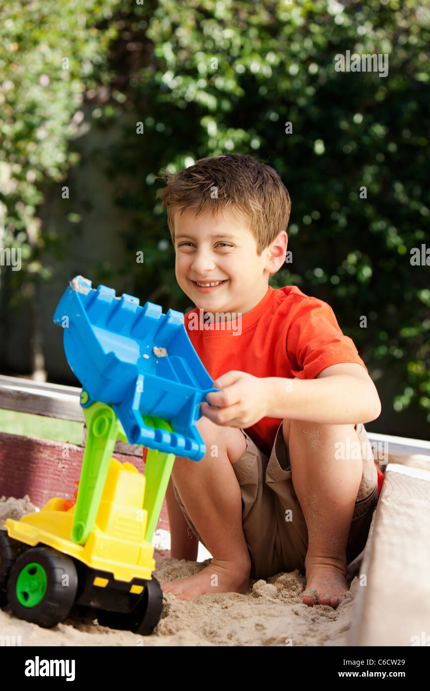 Caucasian boy playing in sandbox Stock Photo - Alamy