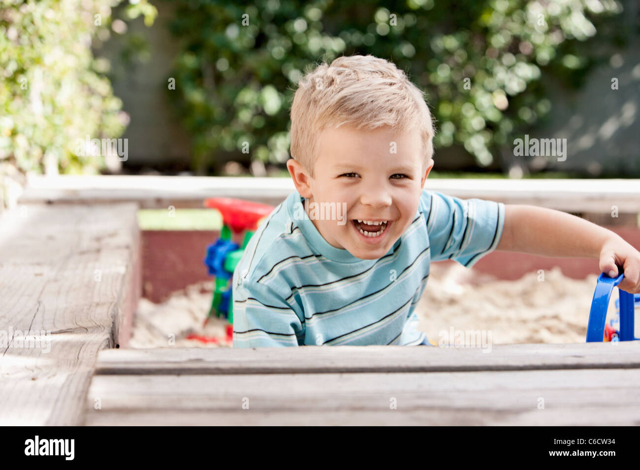 Caucasian boy playing in sandbox Stock Photo - Alamy