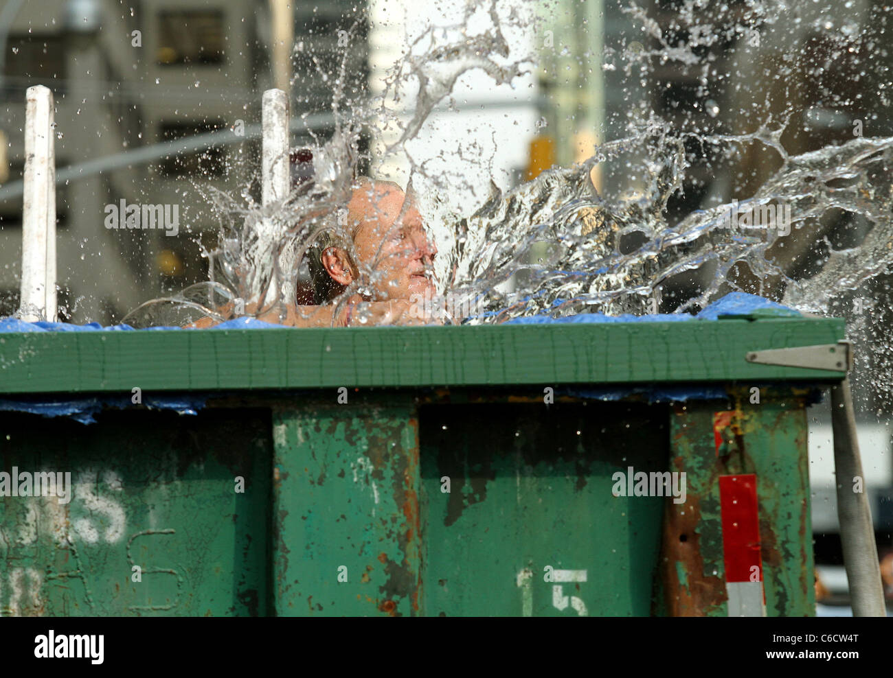 Bill Murray splashing into a makeshift pool while filming a segment ...