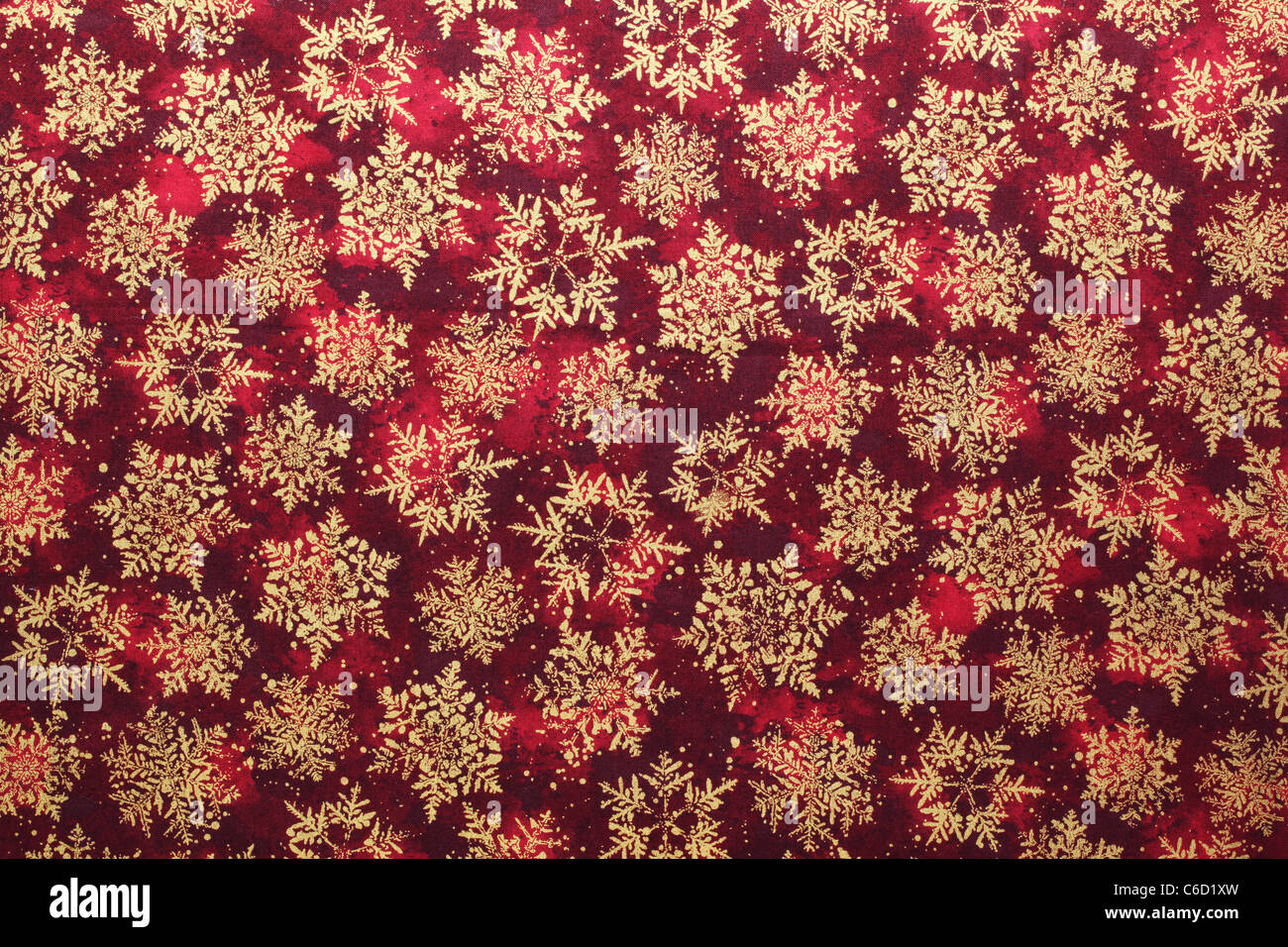 Golden snowflake pattern fabric background Stock Photo - Alamy