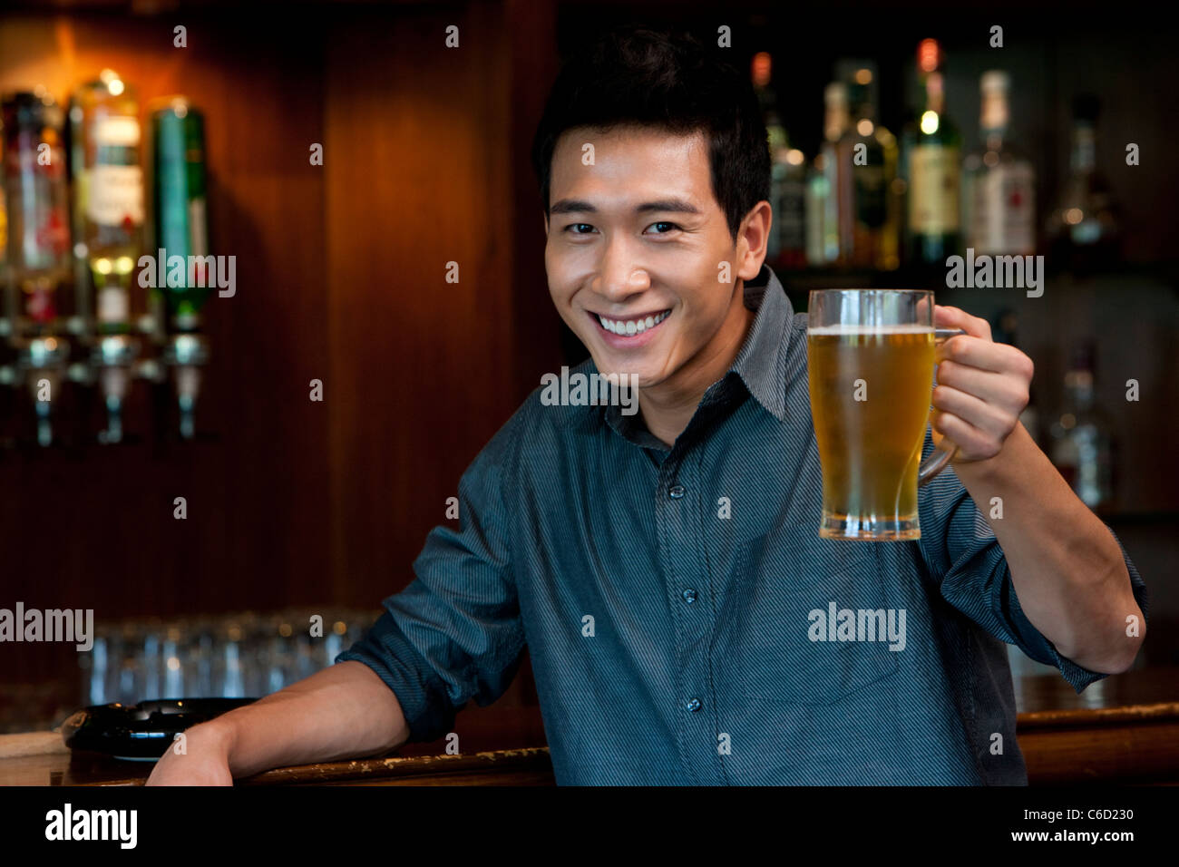 A Man Relaxing at a Bar Stock Photo - Alamy