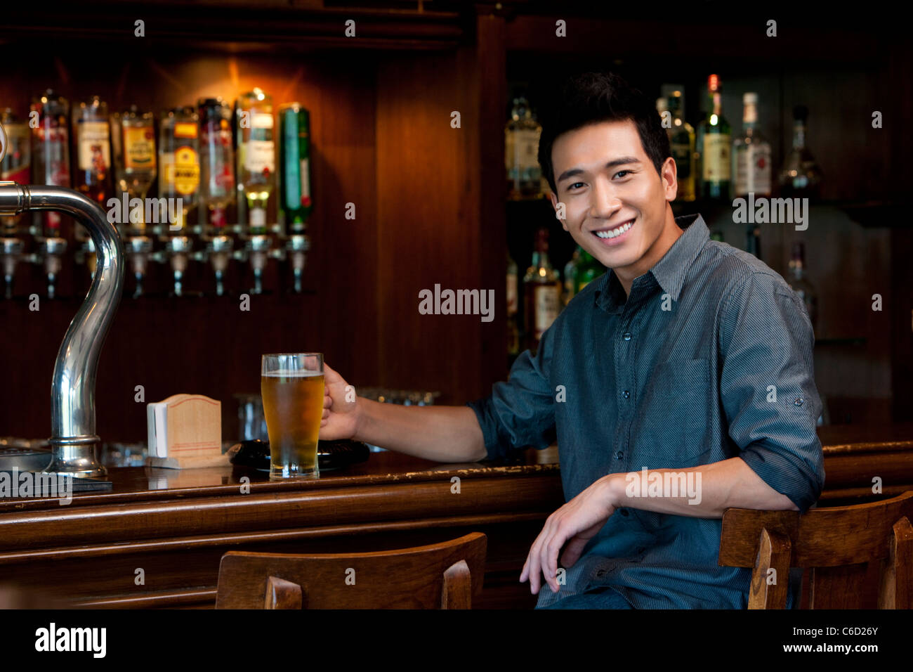 A Man Relaxing at a Bar Stock Photo - Alamy