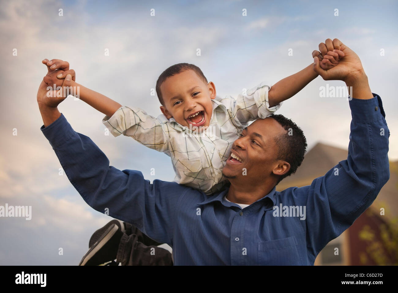Father carrying son on back Stock Photo - Alamy
