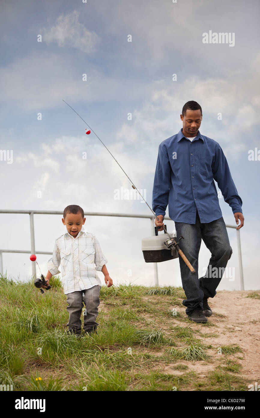 Father and son going fishing together Stock Photo - Alamy