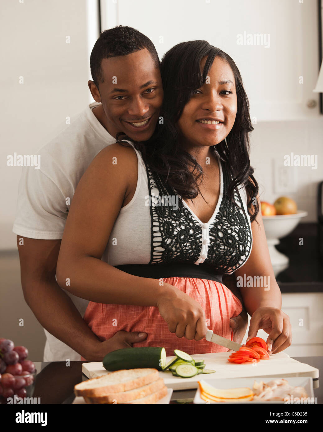Couple cooking together in kitchen Stock Photo - Alamy
