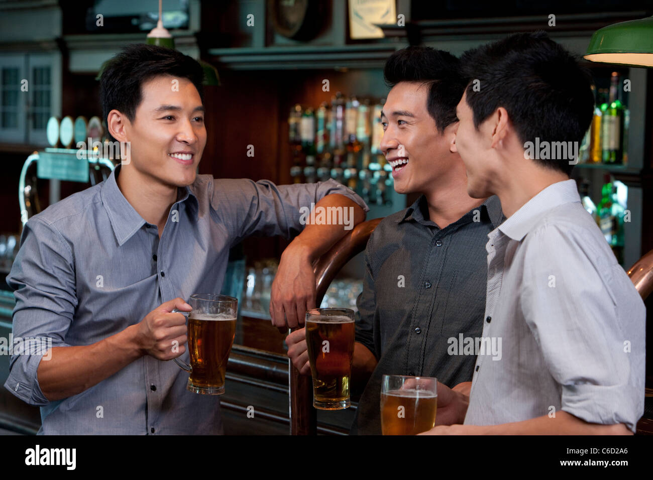 Friends Relaxing at a Bar Stock Photo - Alamy