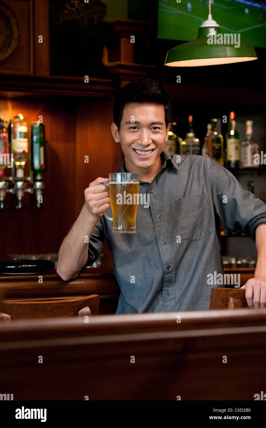 A Man Relaxing at a Bar Stock Photo - Alamy