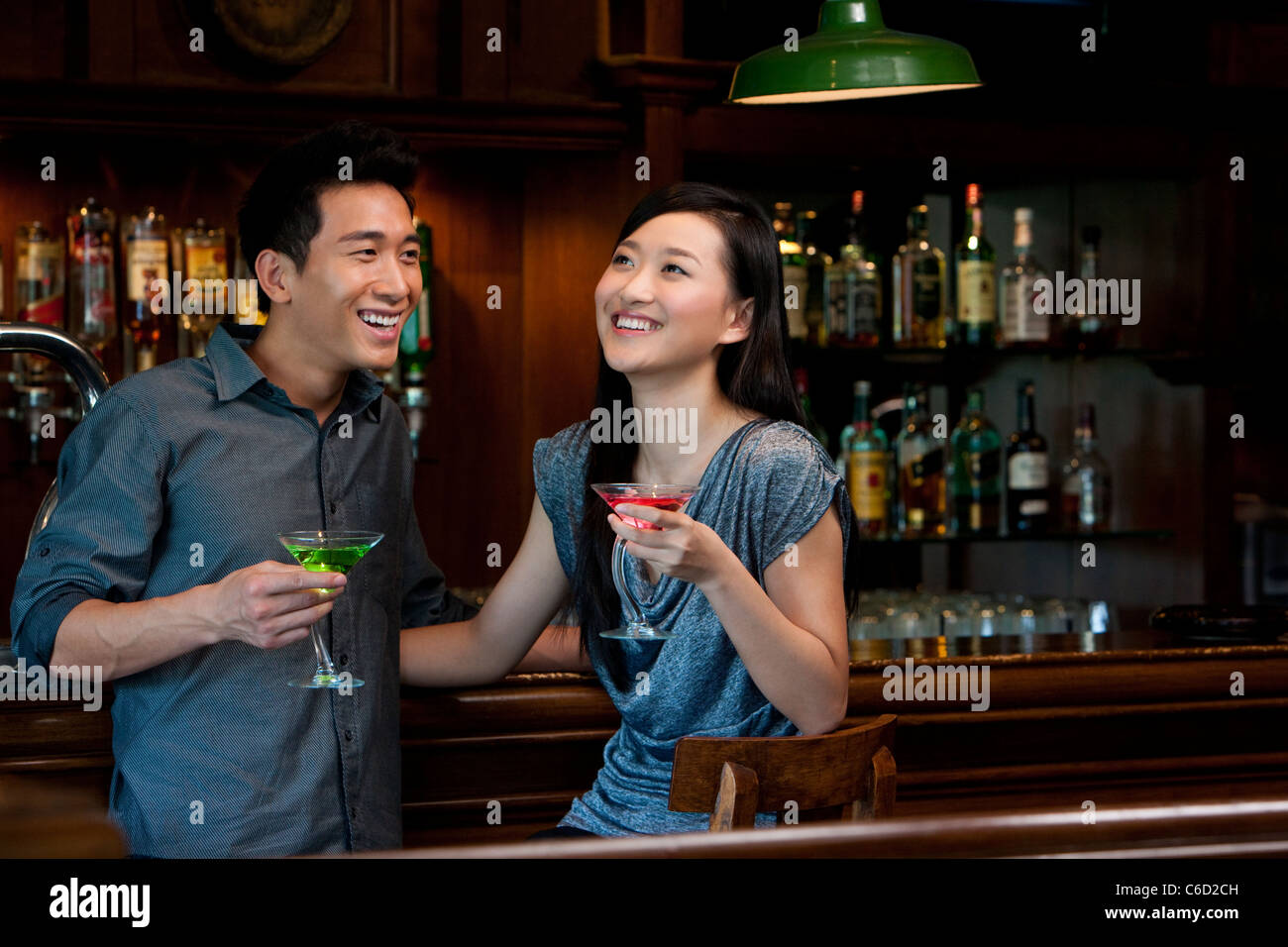 Couple Enjoying Cocktails Together Stock Photo - Alamy