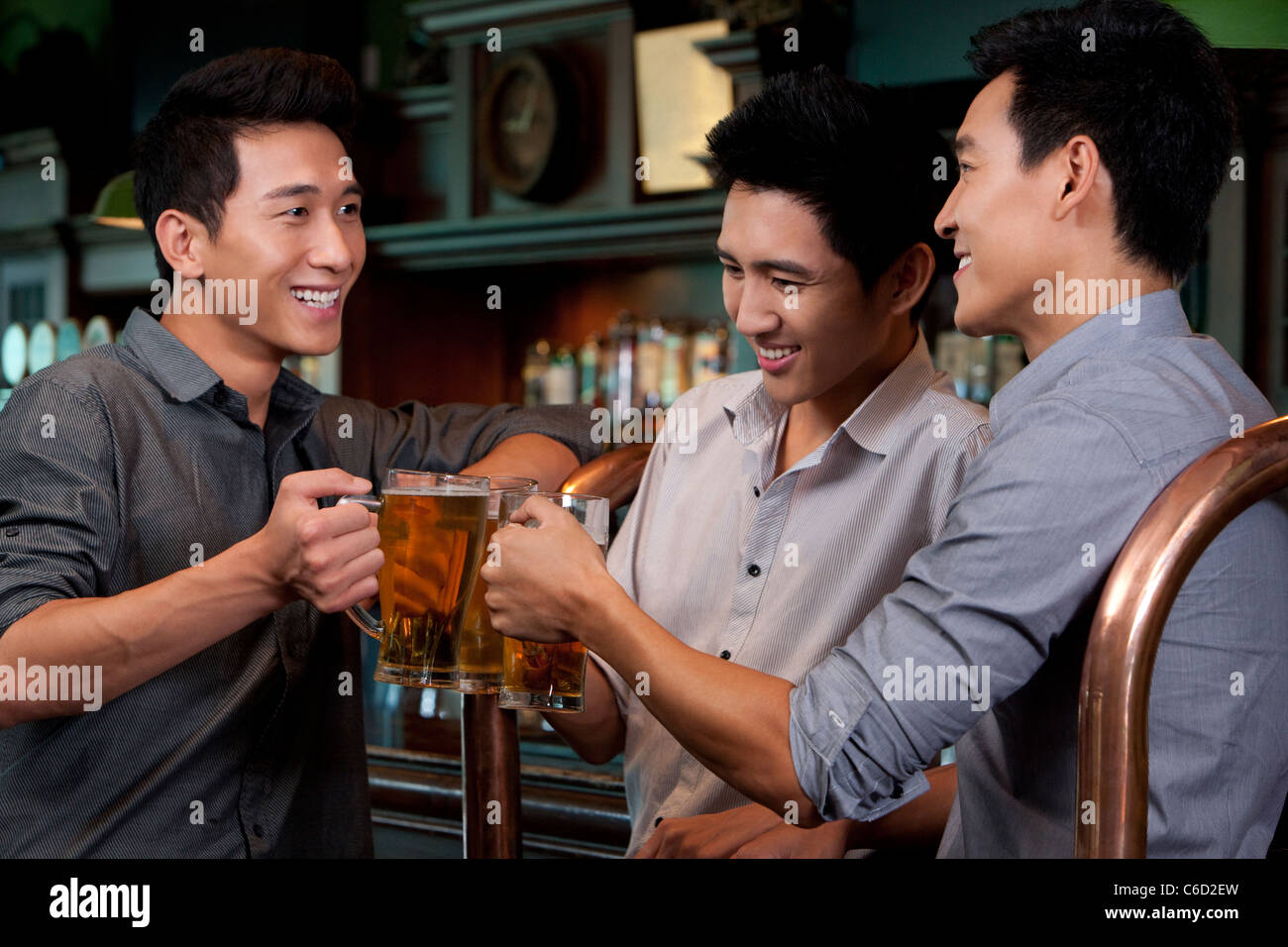 Friends Relaxing at a Bar Stock Photo - Alamy