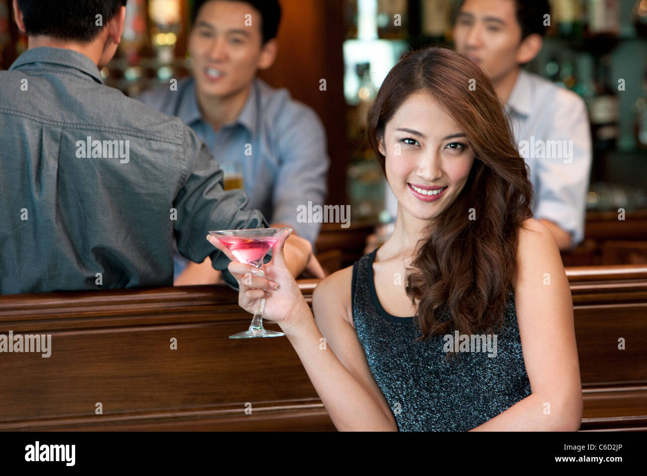 Portrait of a Woman at a Bar Stock Photo - Alamy