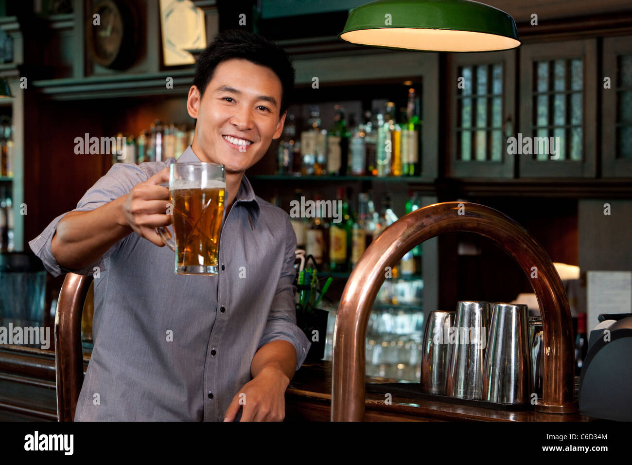 A Man Relaxing at a Bar Stock Photo - Alamy