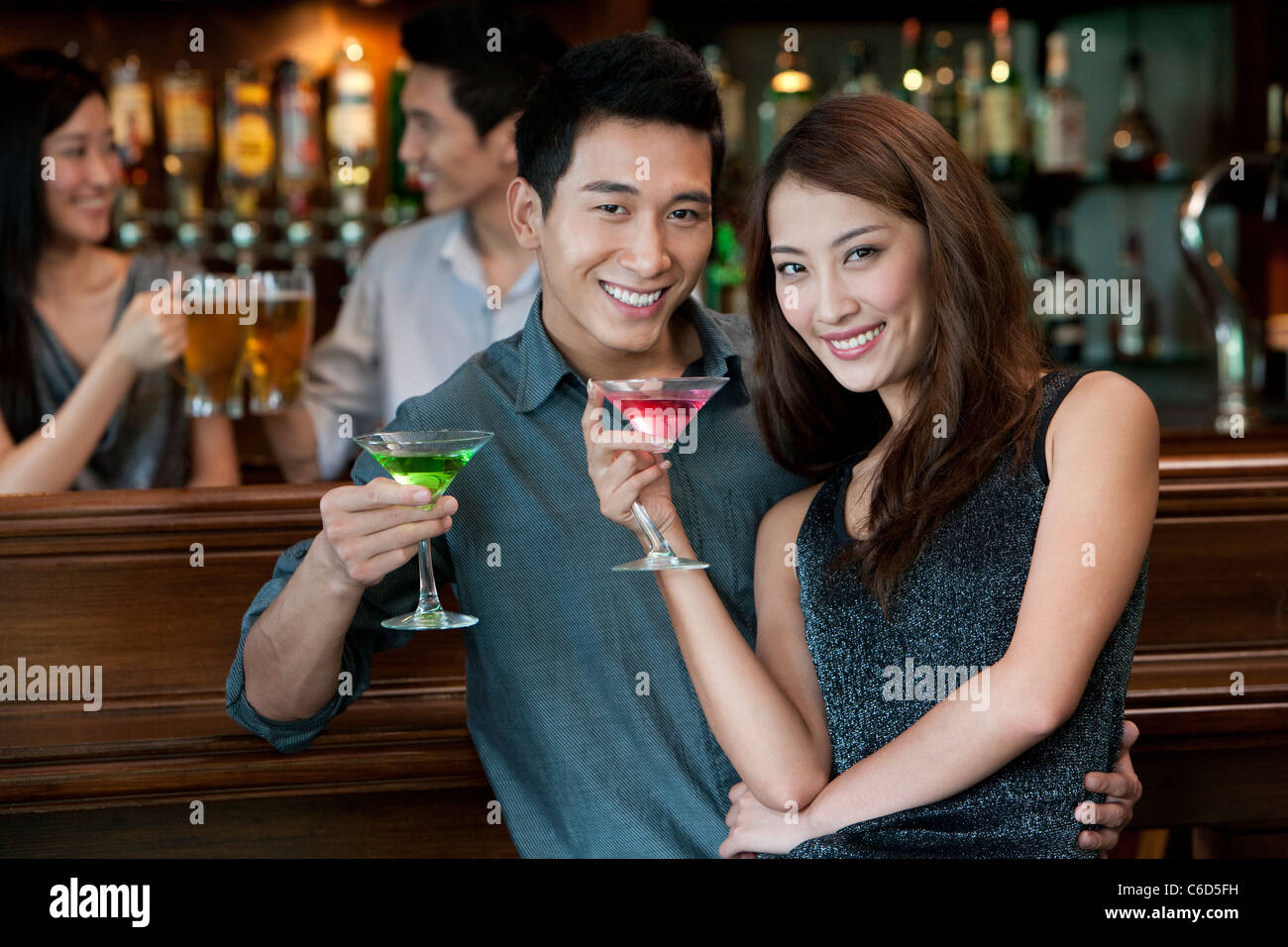 Couple Enjoying Cocktails Together Stock Photo - Alamy