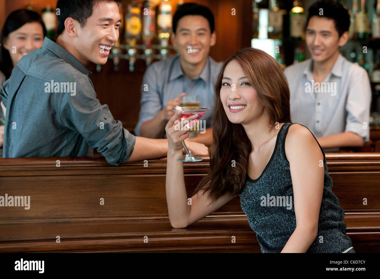 Friends Relaxing at a Bar Stock Photo - Alamy