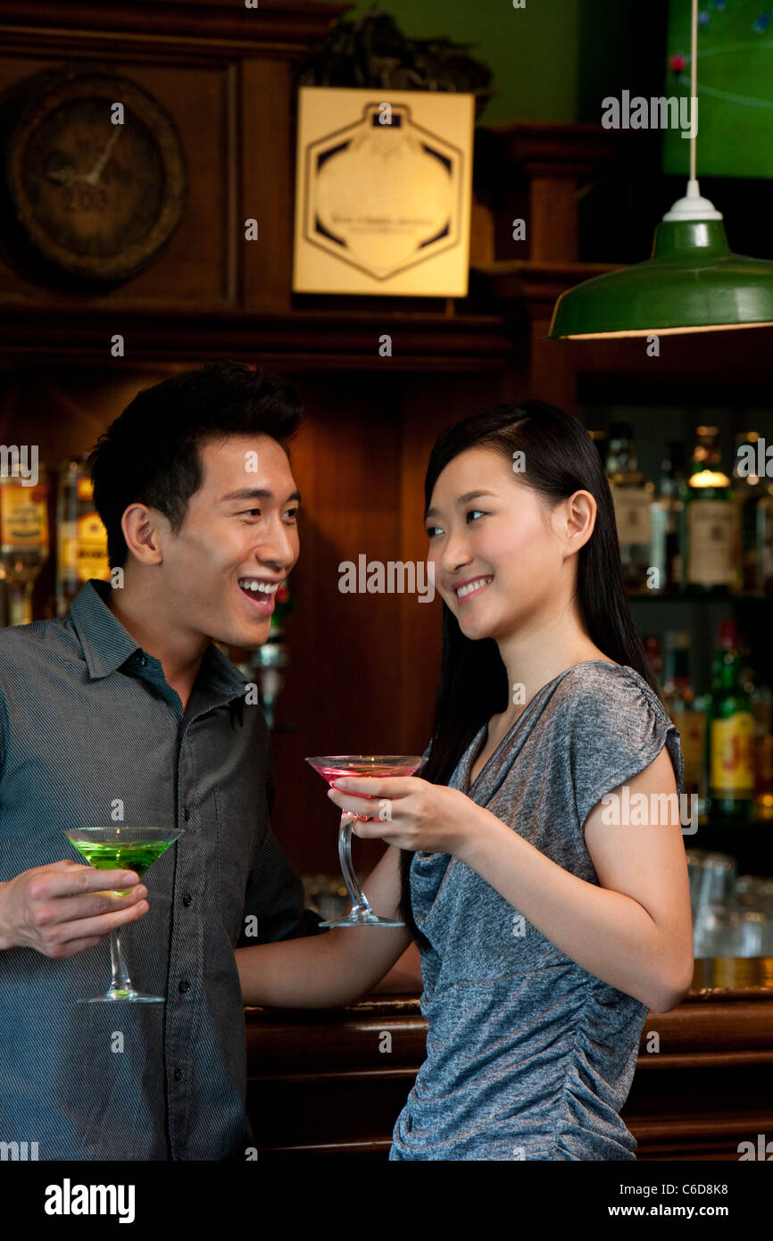 Couple Enjoying Cocktails Together Stock Photo - Alamy