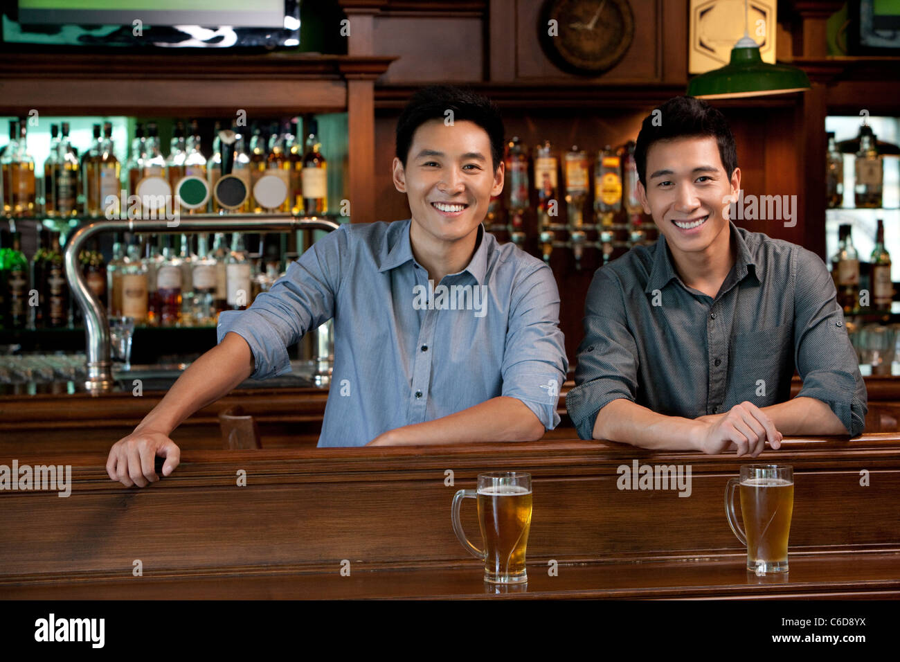 Friends Relaxing at a Bar Stock Photo - Alamy