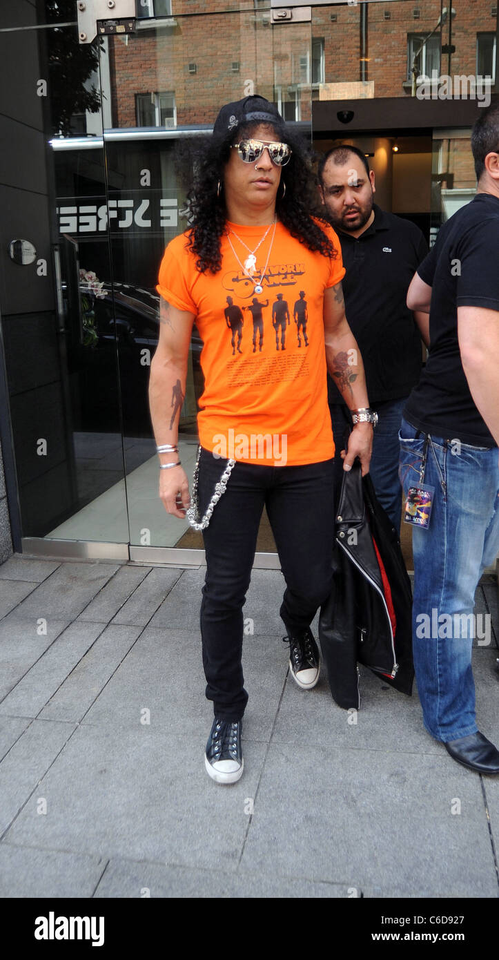 Former Guns N' Roses guitarist Slash signs autographs for fans as he ...