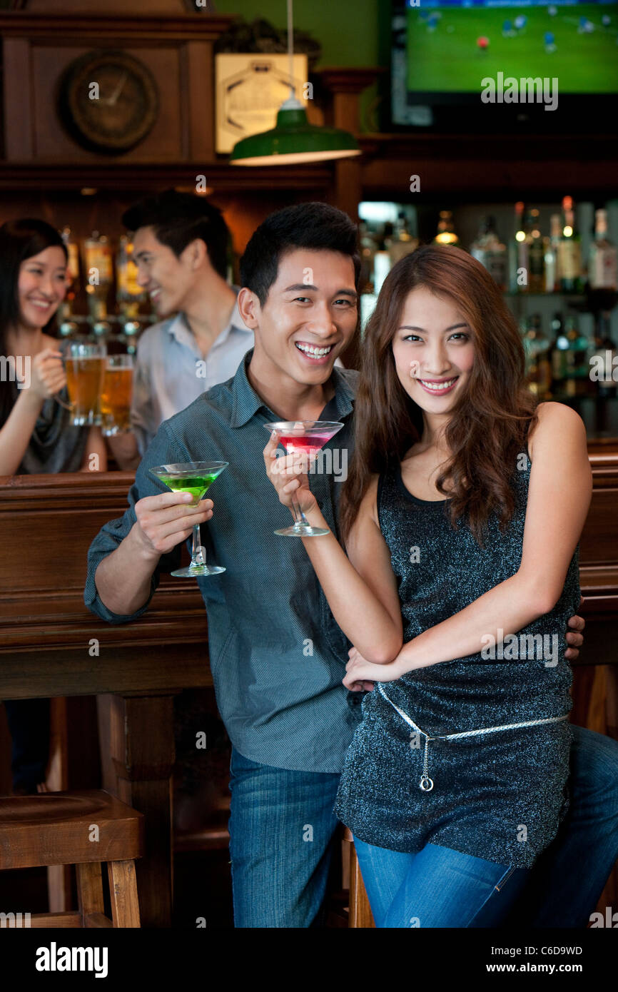 Couple Enjoying Cocktails Together Stock Photo - Alamy