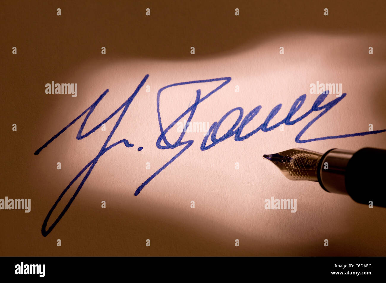 Handwritten signature with pen on a letter Stock Photo - Alamy