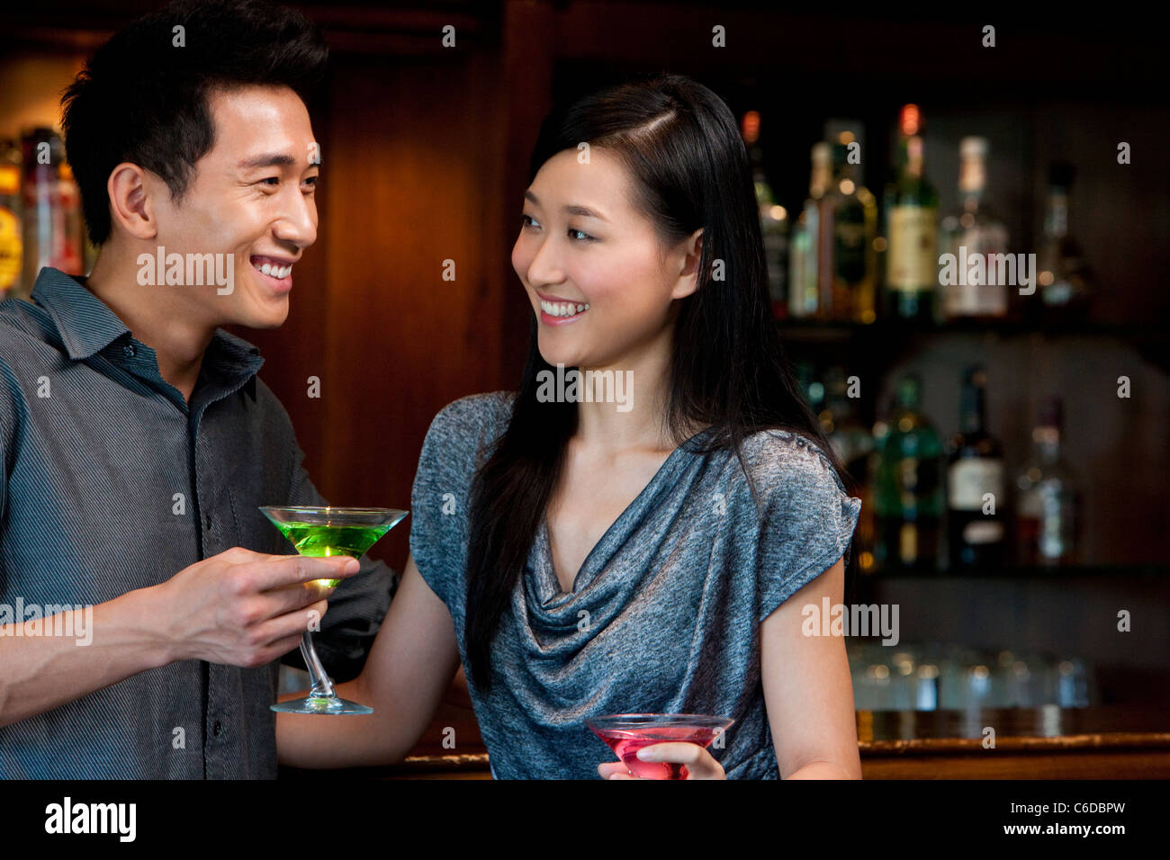 Couple Enjoying Cocktails Together Stock Photo - Alamy