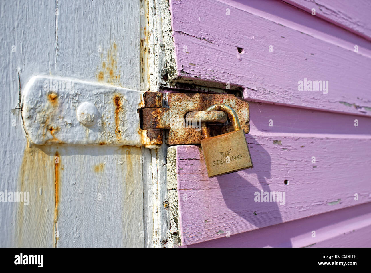 padlock on a painted wooden door Stock Photo - Alamy