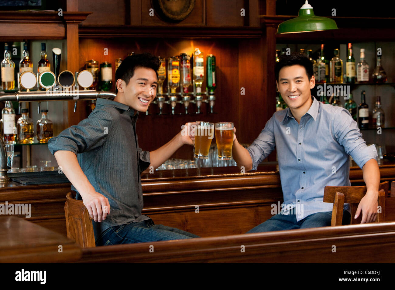 Friends Relaxing at a Bar Stock Photo - Alamy