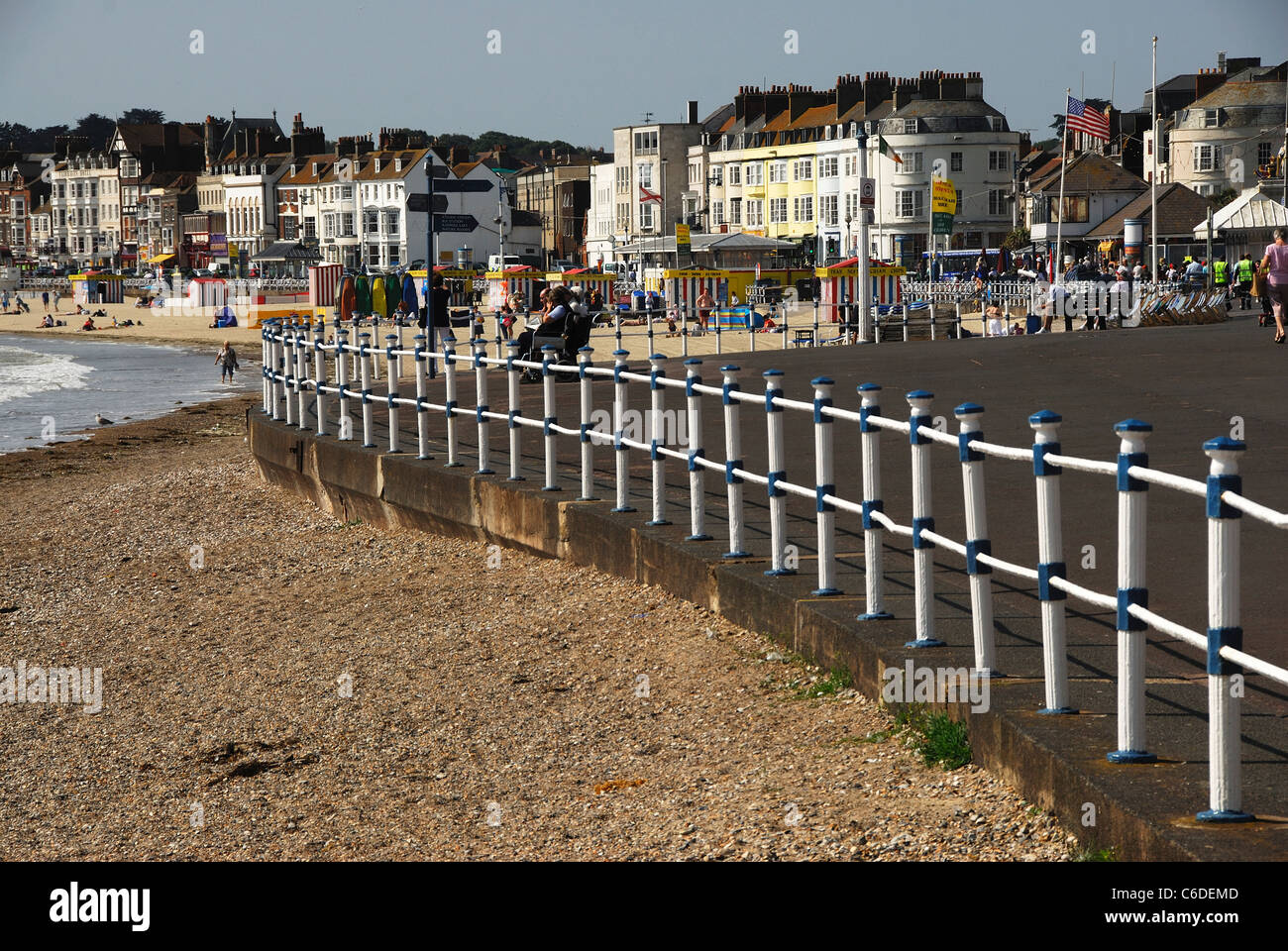 The Georgian Weymouth seafront with the beach, houses and railings UK ...