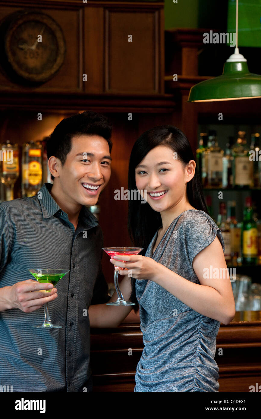 Couple Enjoying Cocktails Together Stock Photo - Alamy