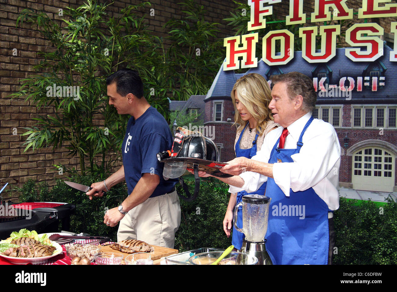 Kelly Ripa and Regis Philbin with Firefighter RJ Schnelker filming a ...
