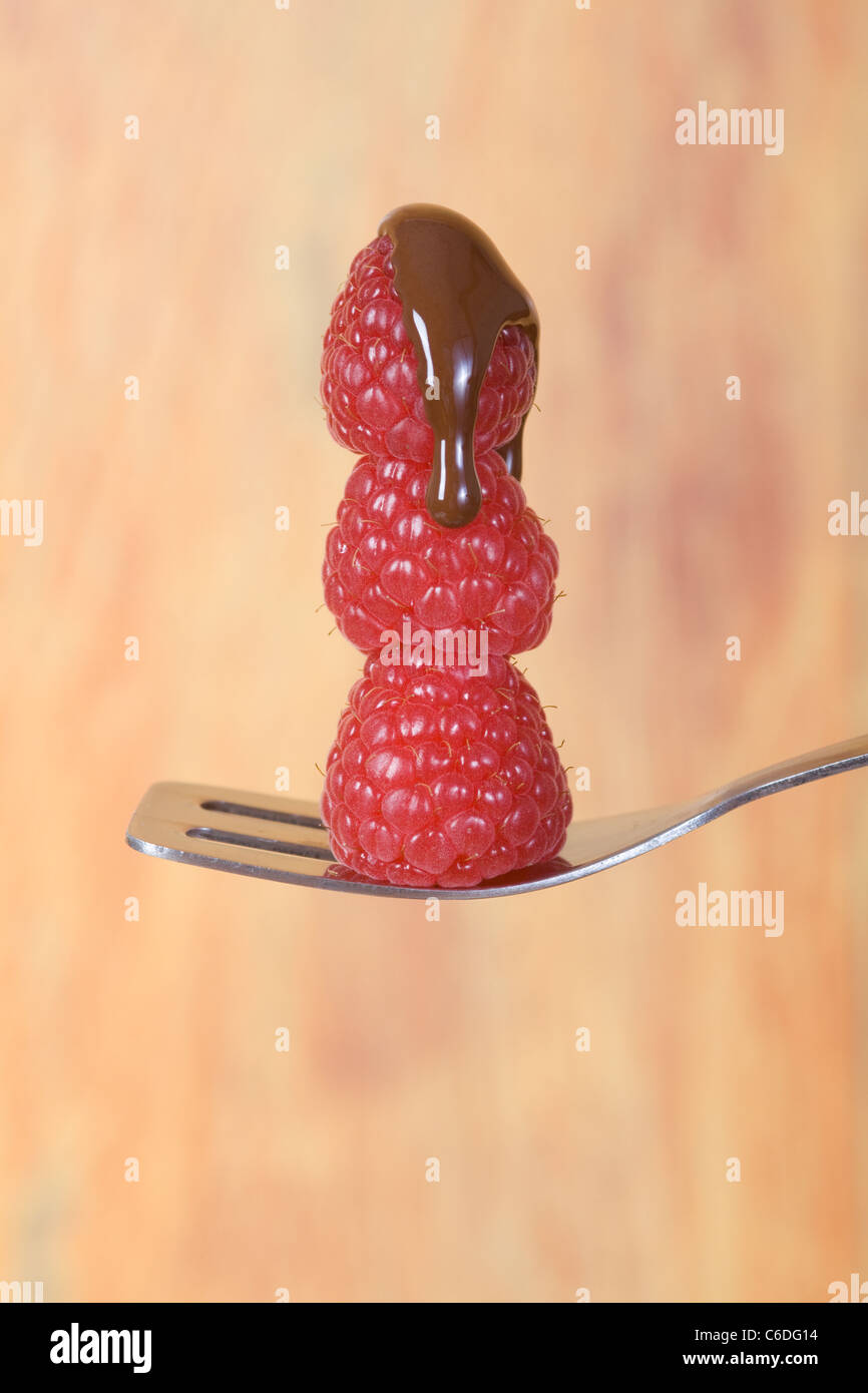 Raspberry with a chocolate topping Stock Photo - Alamy