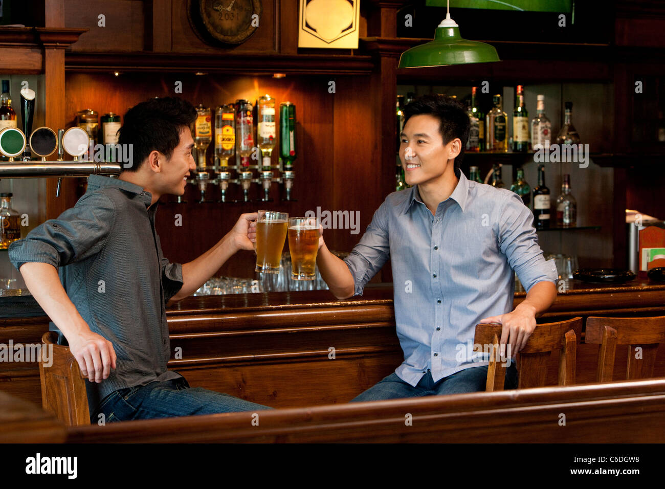 Friends Relaxing at a Bar Stock Photo - Alamy