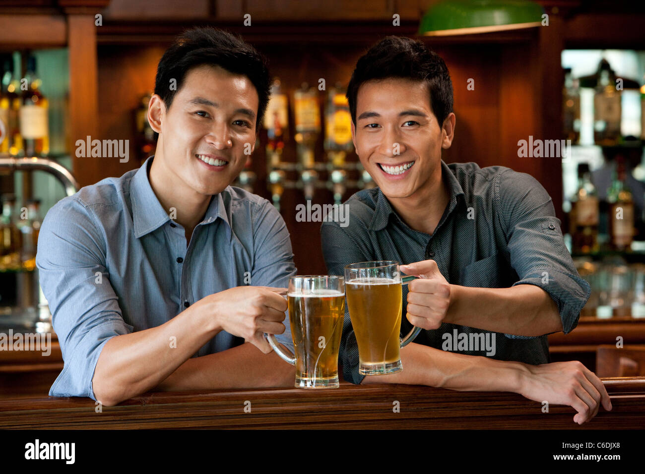 Friends Relaxing at a Bar Stock Photo - Alamy