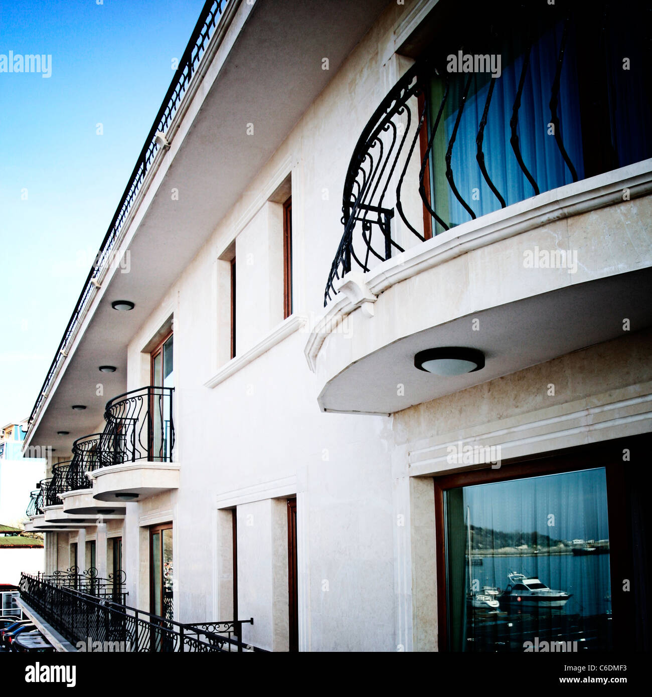 Sea reflecting in a hotel window Stock Photo - Alamy