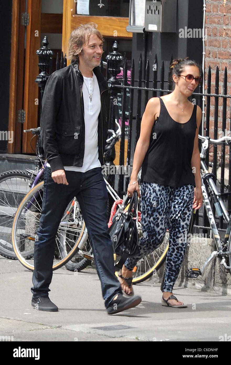 Andy Bell the bassist for the rock band Oasis, with his wife Shiarra ...