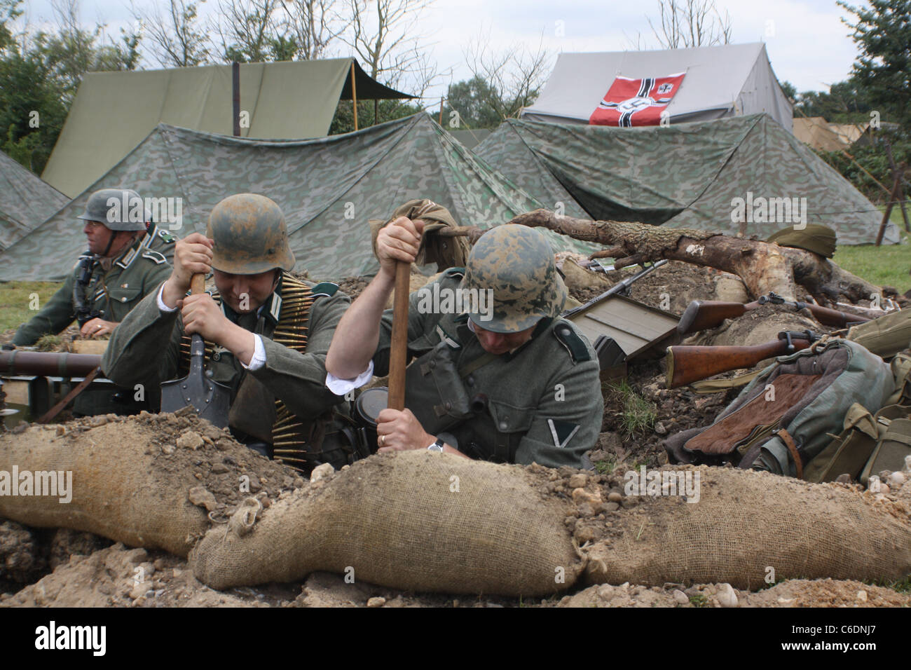 German soldiers digging fox hole at war re-enactment show Stock Photo ...