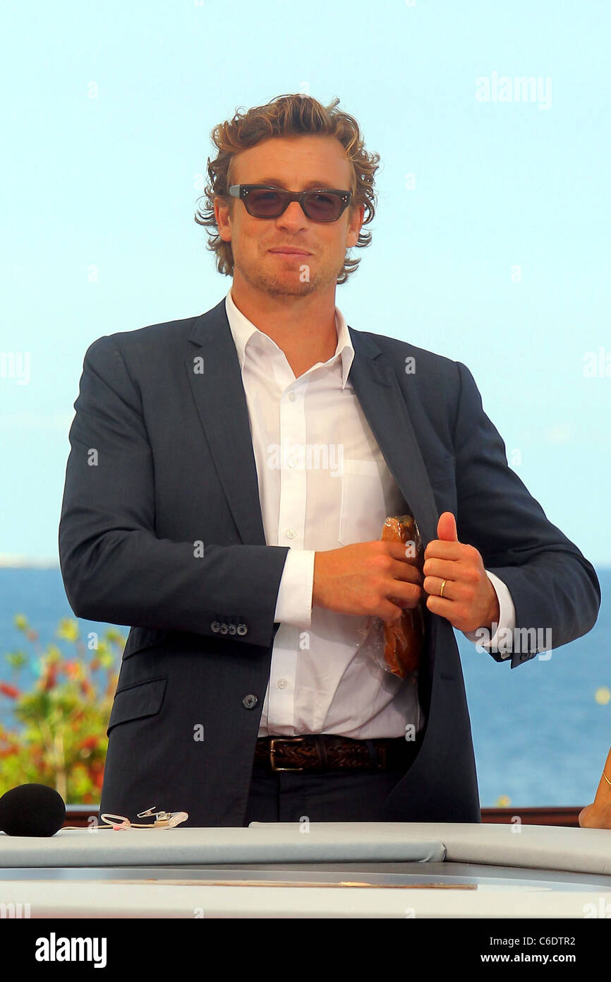 Simon Baker accepts a French sandwich from the press 50th anniversary ...