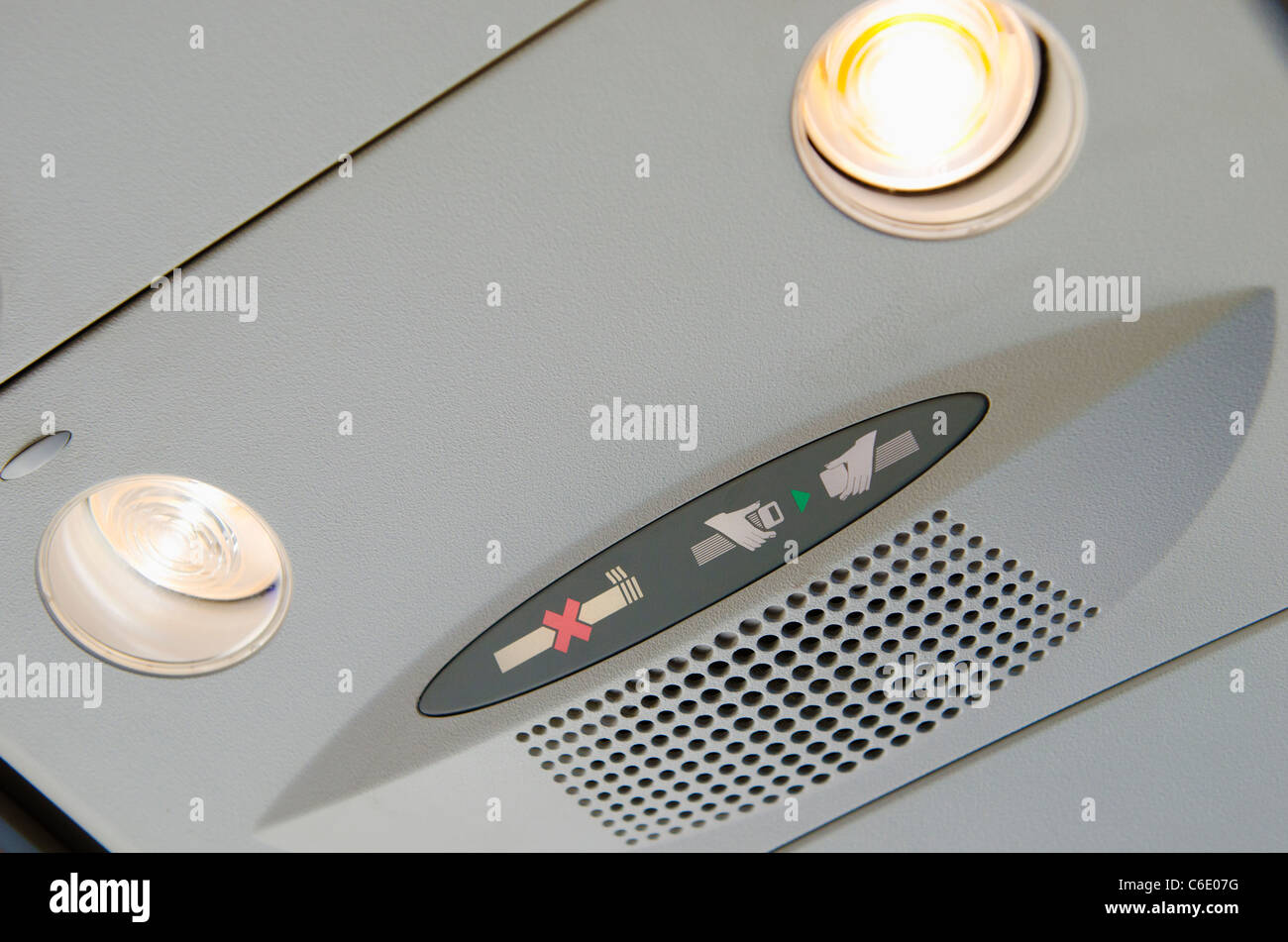 Warning signs in airplane cabin Stock Photo - Alamy