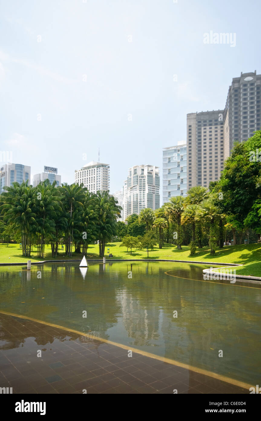 KLCC Park at the Petronas Twin Towers in front of the skyline with ...