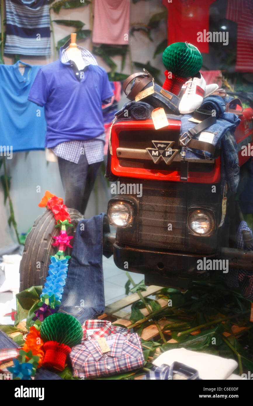 Old farm tractor being used in the decoration of a shop window Stock ...