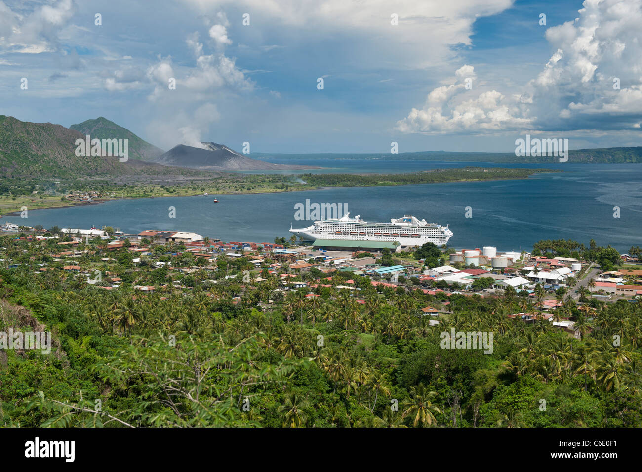 View over Rabaul Town with Cruise Ship and Active Volcano Tavurvur in ...