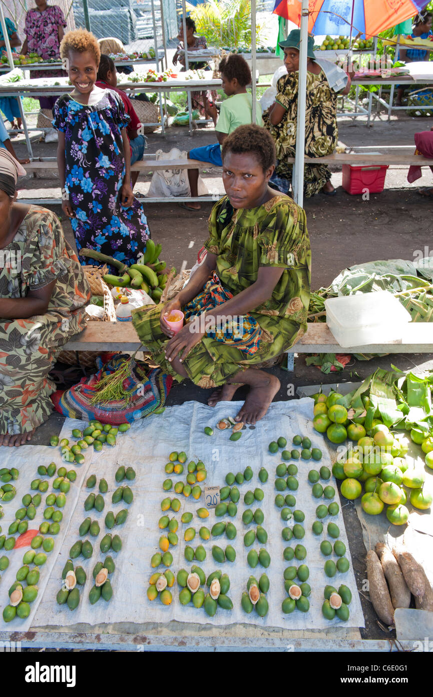 Market scene in Rabaul Town with Lady selling Areca or Betal Nuts. East ...