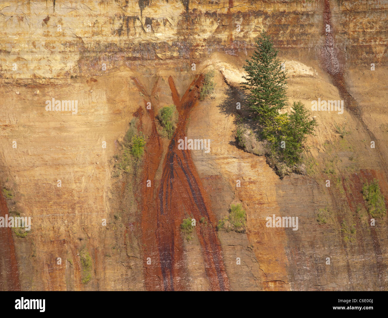 Michigan's Pictured Rocks has streaks on the face of the cliffs that ...