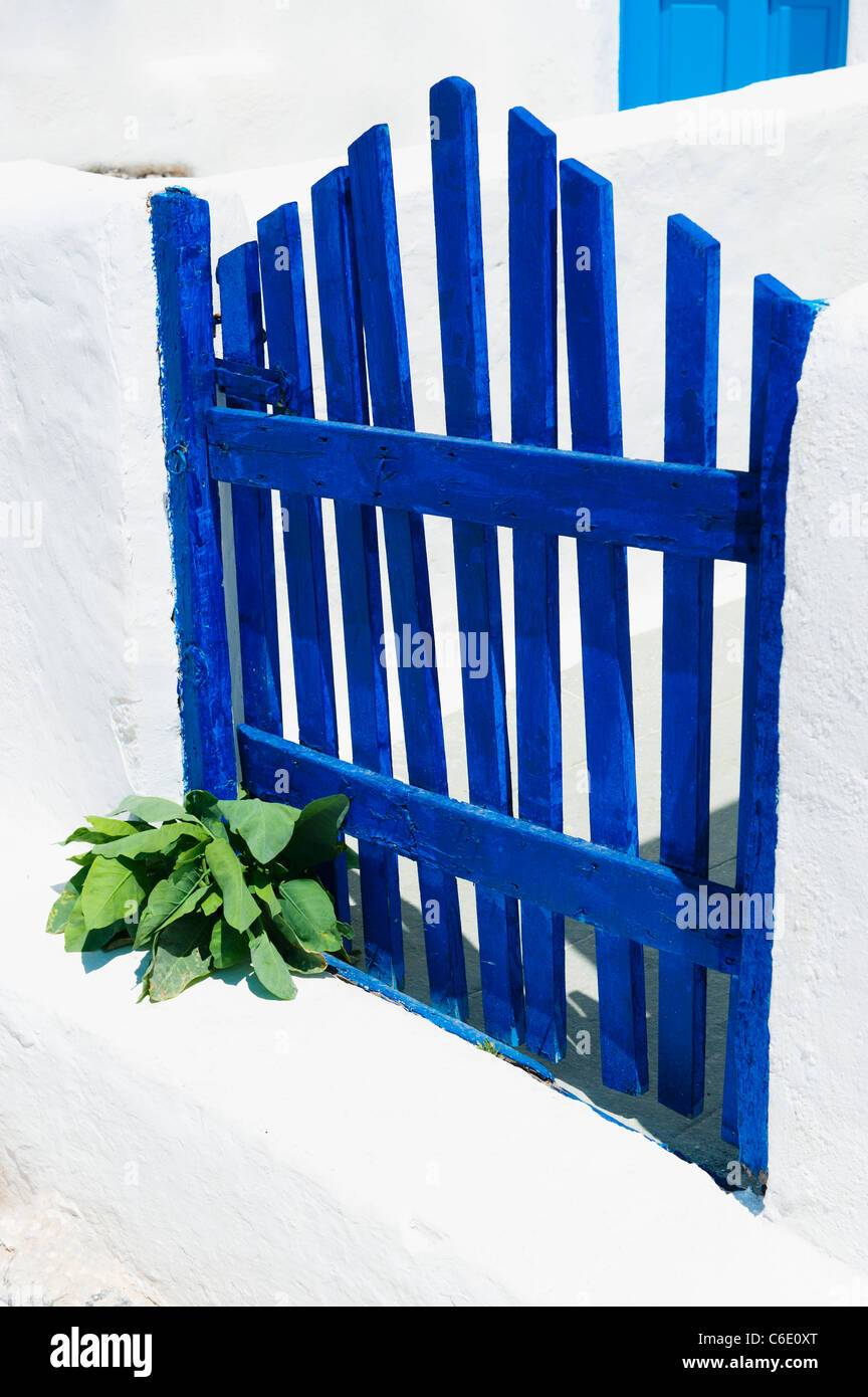 Greece, Cyclades Islands, Santorini, Oia, Blue fence outside house ...