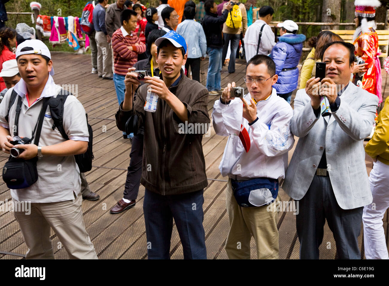 Chinese Tourist With Camera