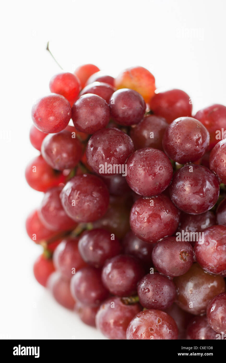 Fresh red grapes on white background Stock Photo - Alamy