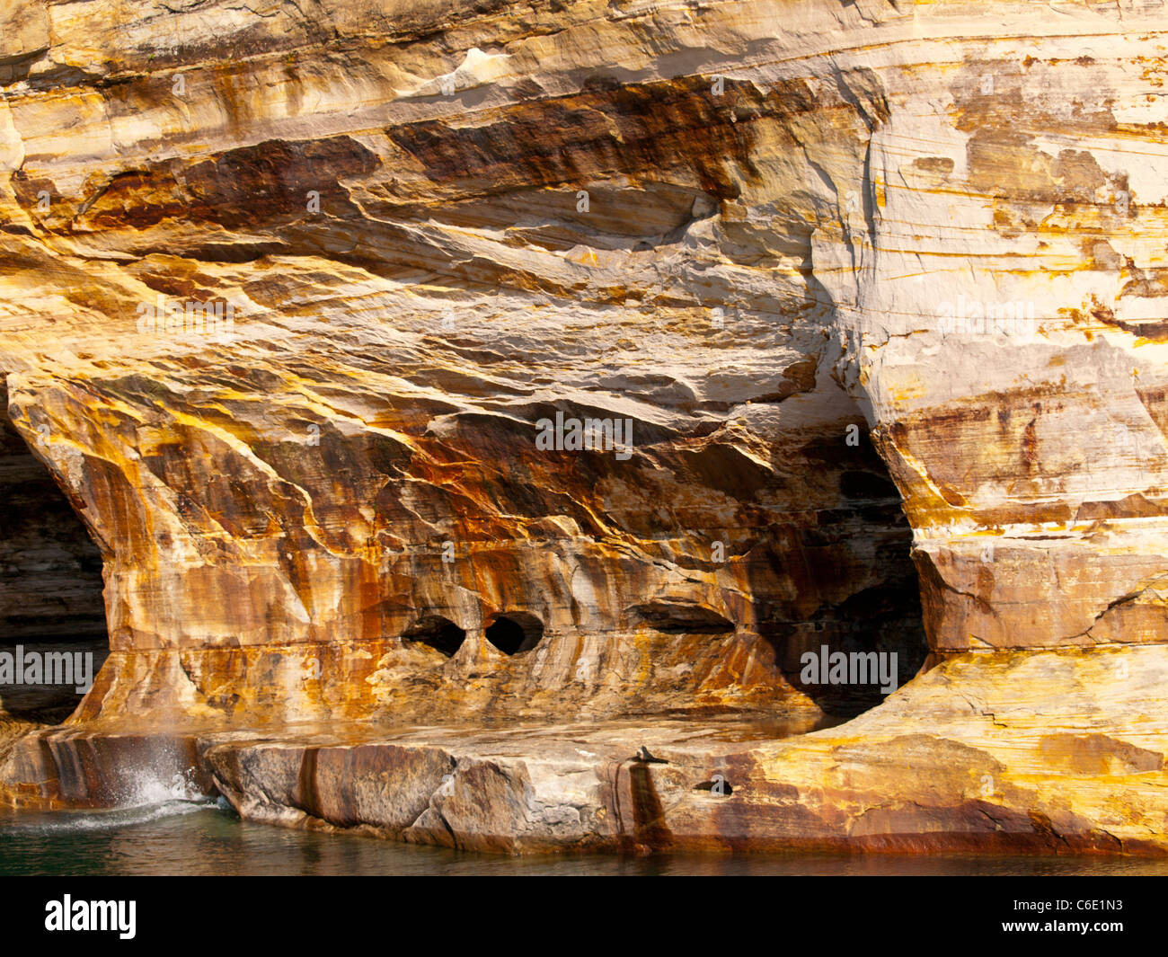 Michigan's Pictured Rocks beautifully colored cliffs has many caves ...