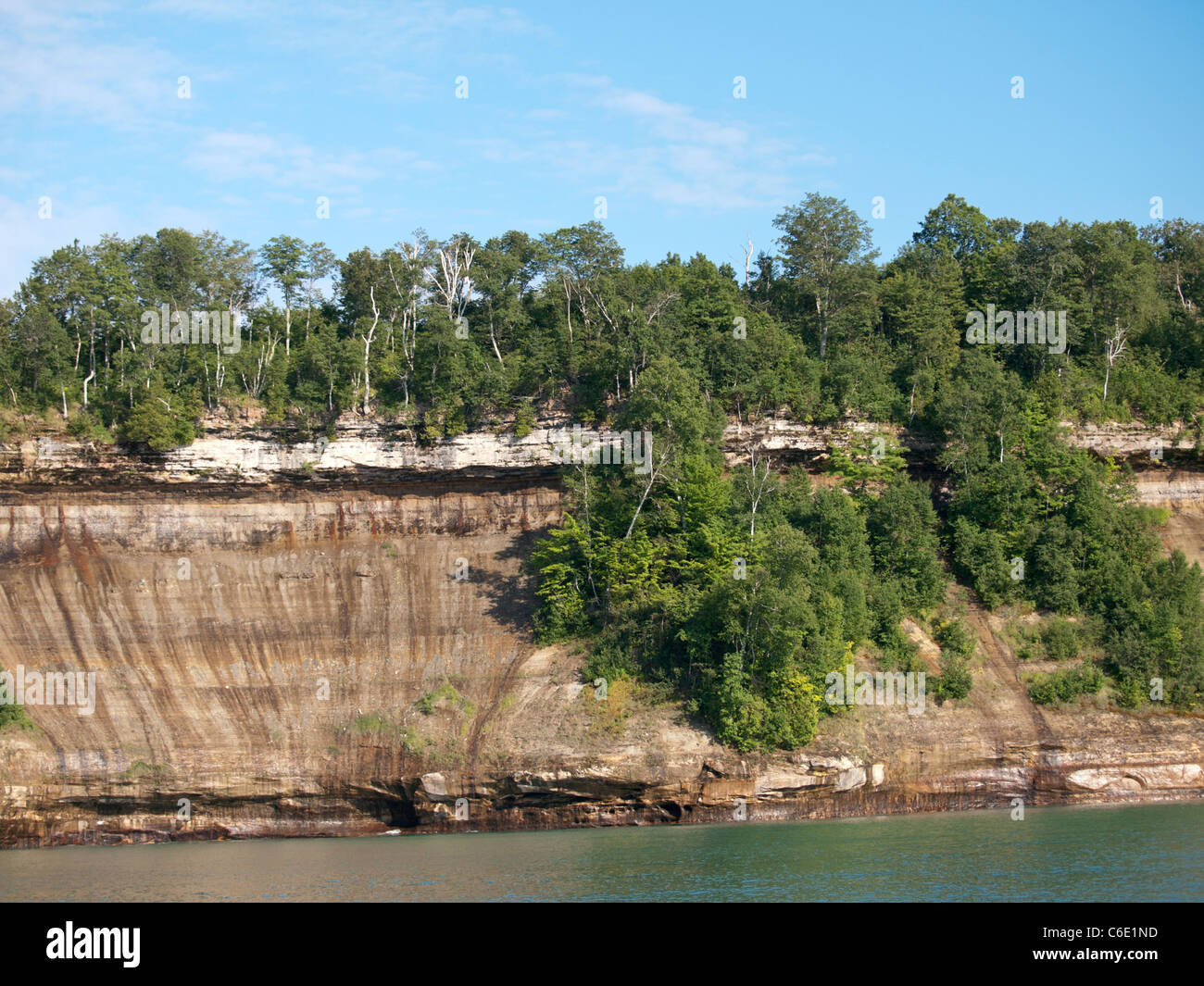 Michigan's Pictured Rocks has streaks on the face of the cliffs that ...