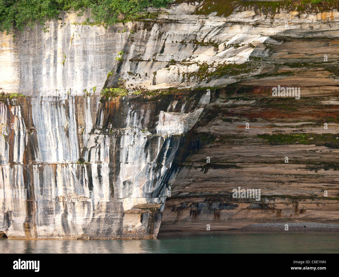 Michigan's Pictured Rocks has streaks on the face of the cliffs that ...