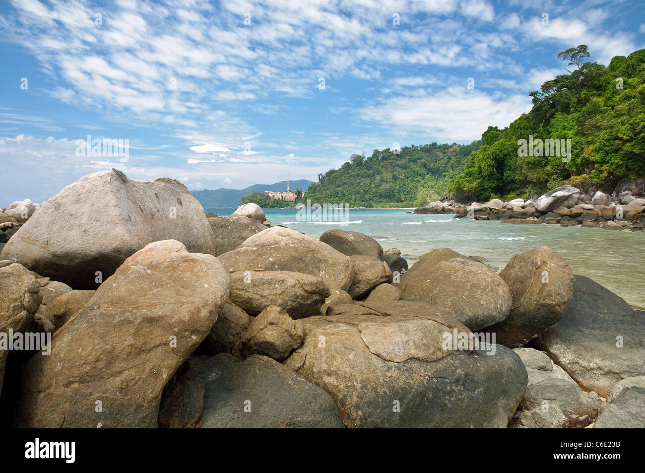 Rocks on the beach of Paya, Berjaya Tioman Island Resort in the back ...