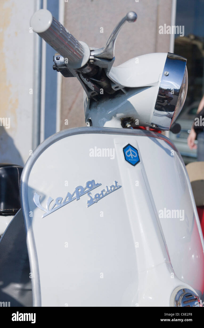 Close up on the front of a Vespa scooter Stock Photo - Alamy