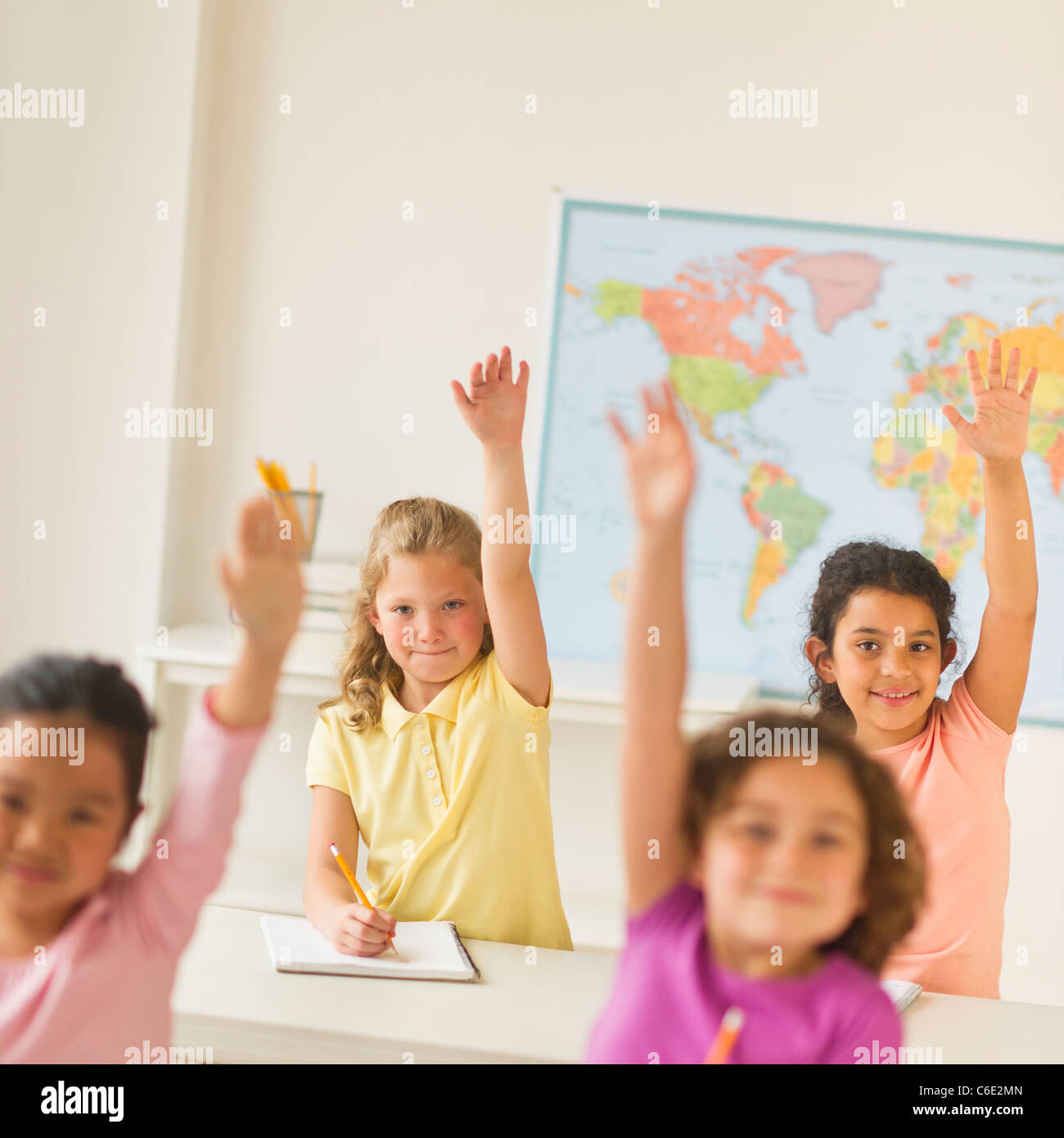 Classroom kids hands up map hi-res stock photography and images - Alamy